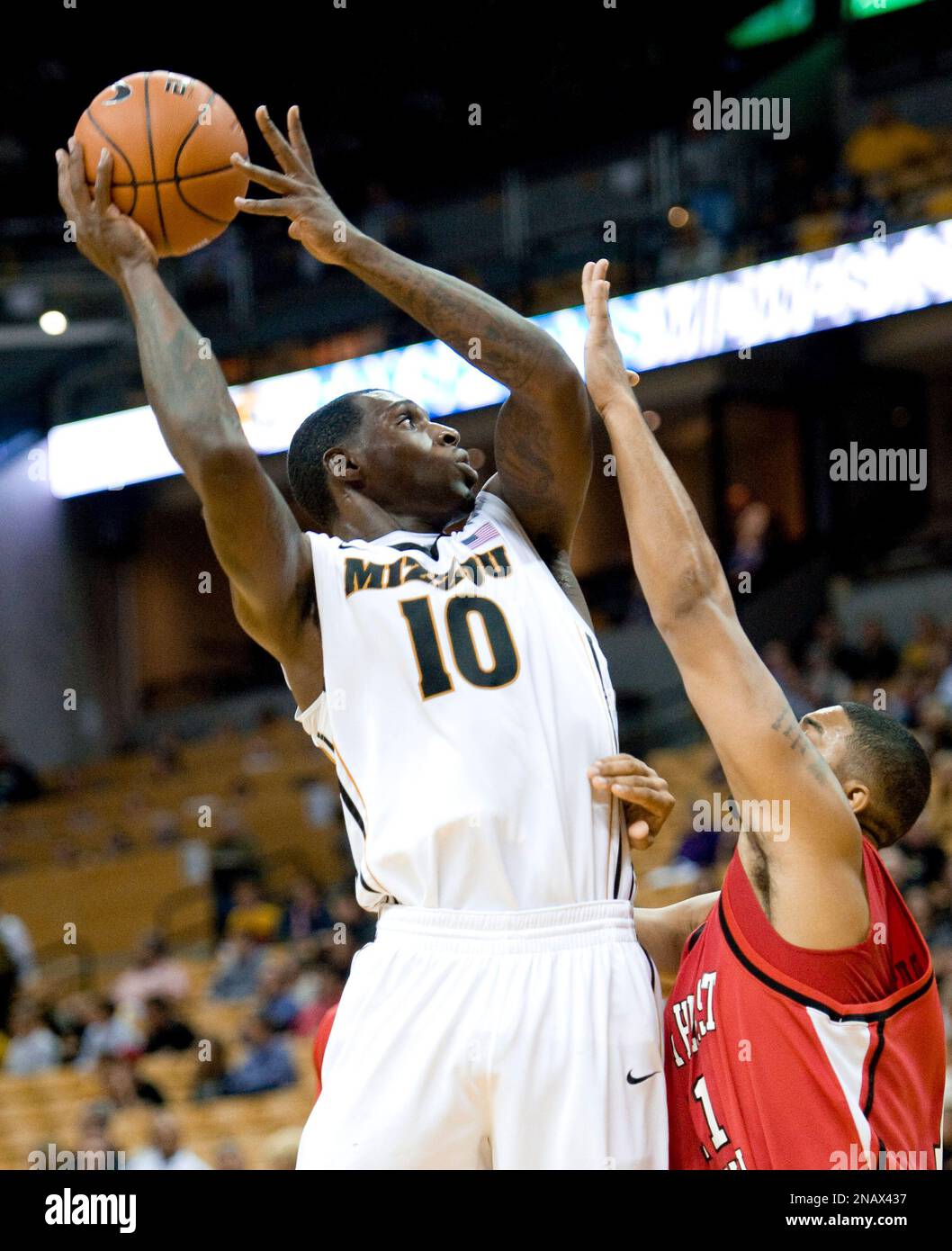 Missouri's Ricardo Ratliffe, left, shoots over Southeast Missouri State ...