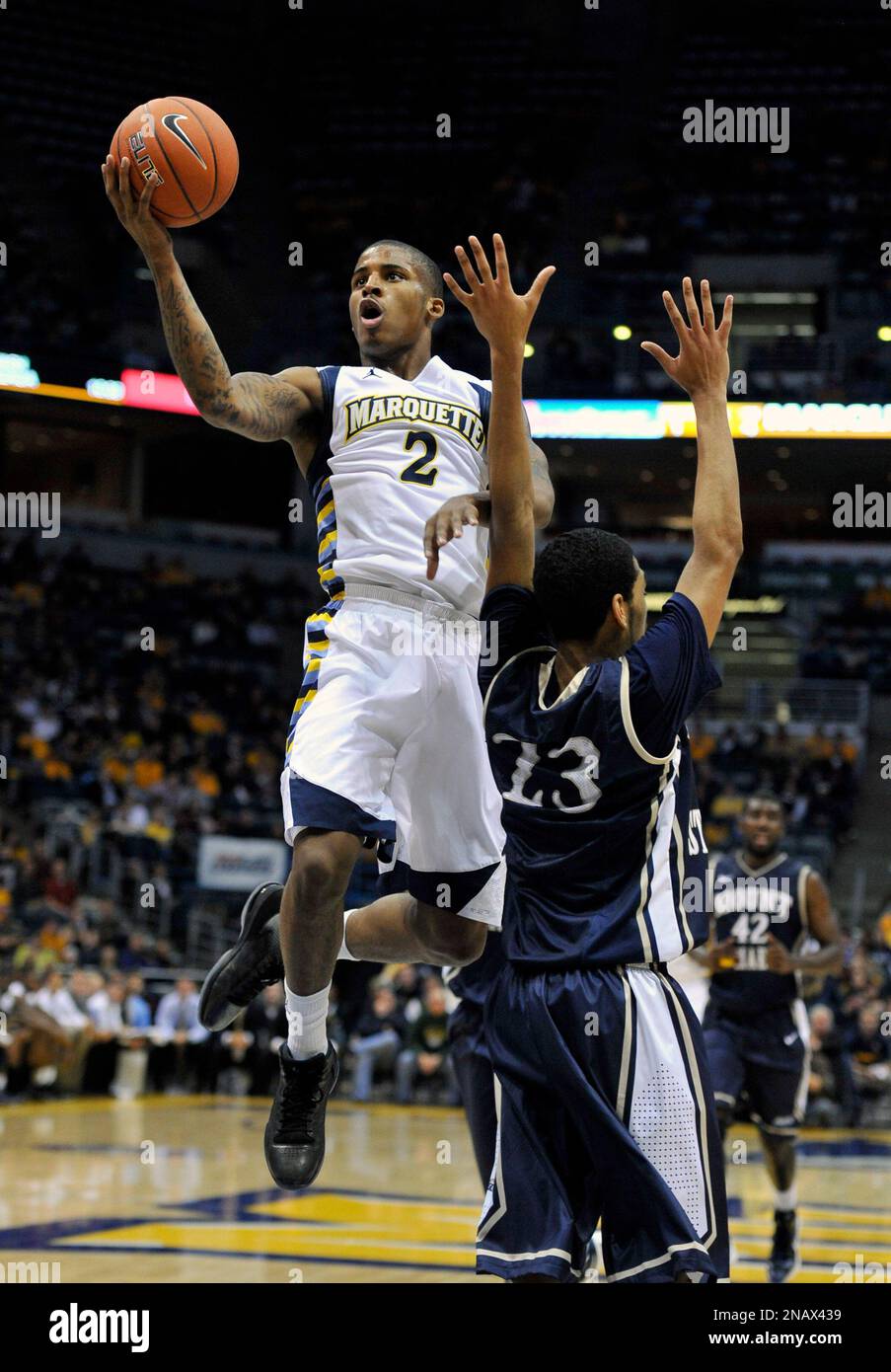 Marquette guard Vander Blue (2) drives past Mount St. Mary's guard ...