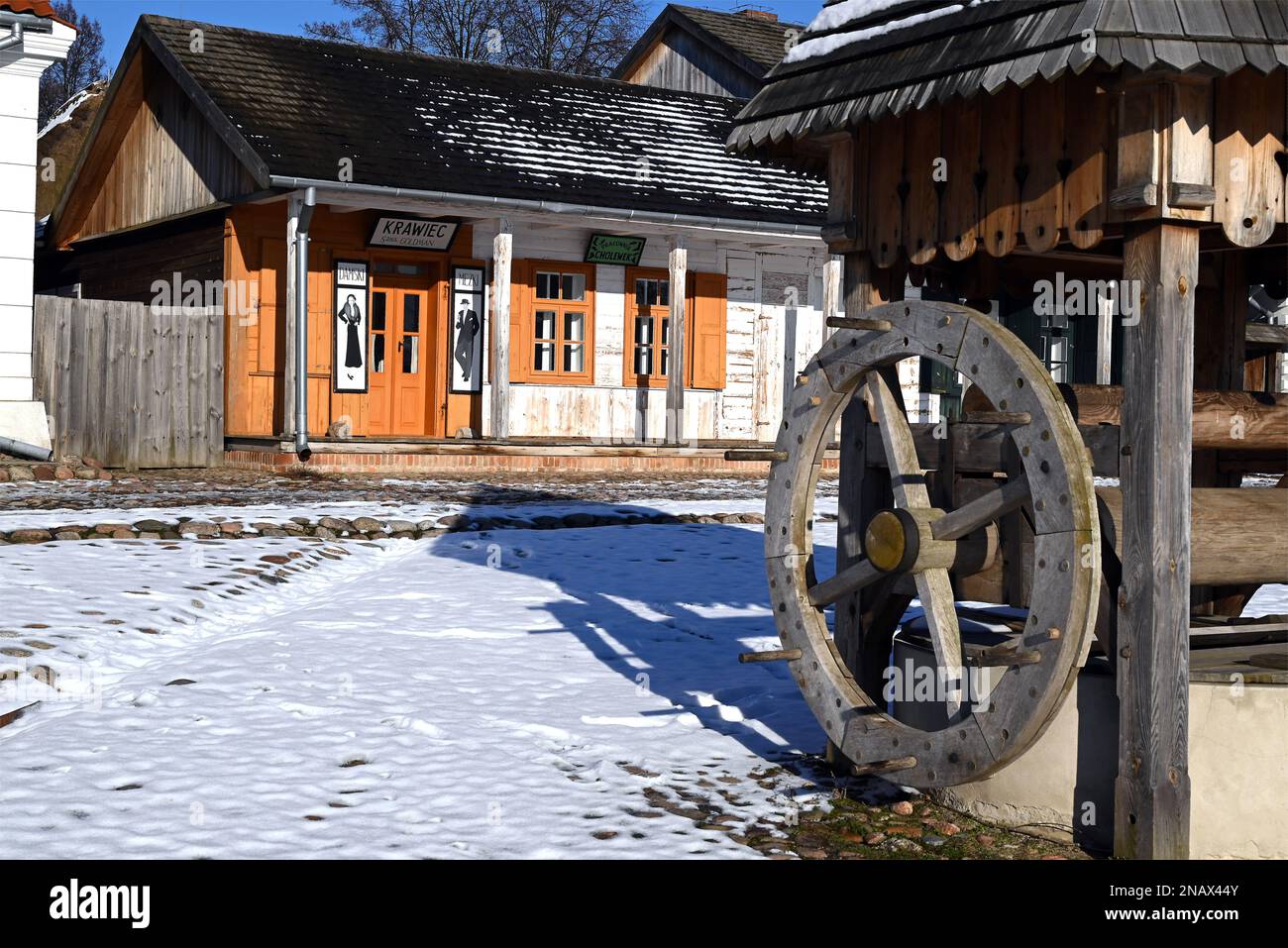 old shops and historic well in market square in provincial town in ...