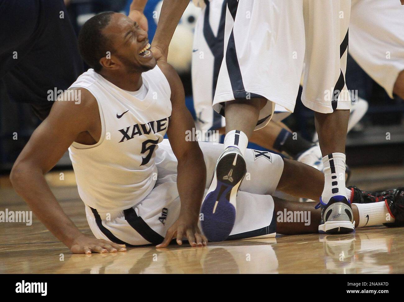 Xavier's Dezmine Wells is injured during the second half of an NCAA ...