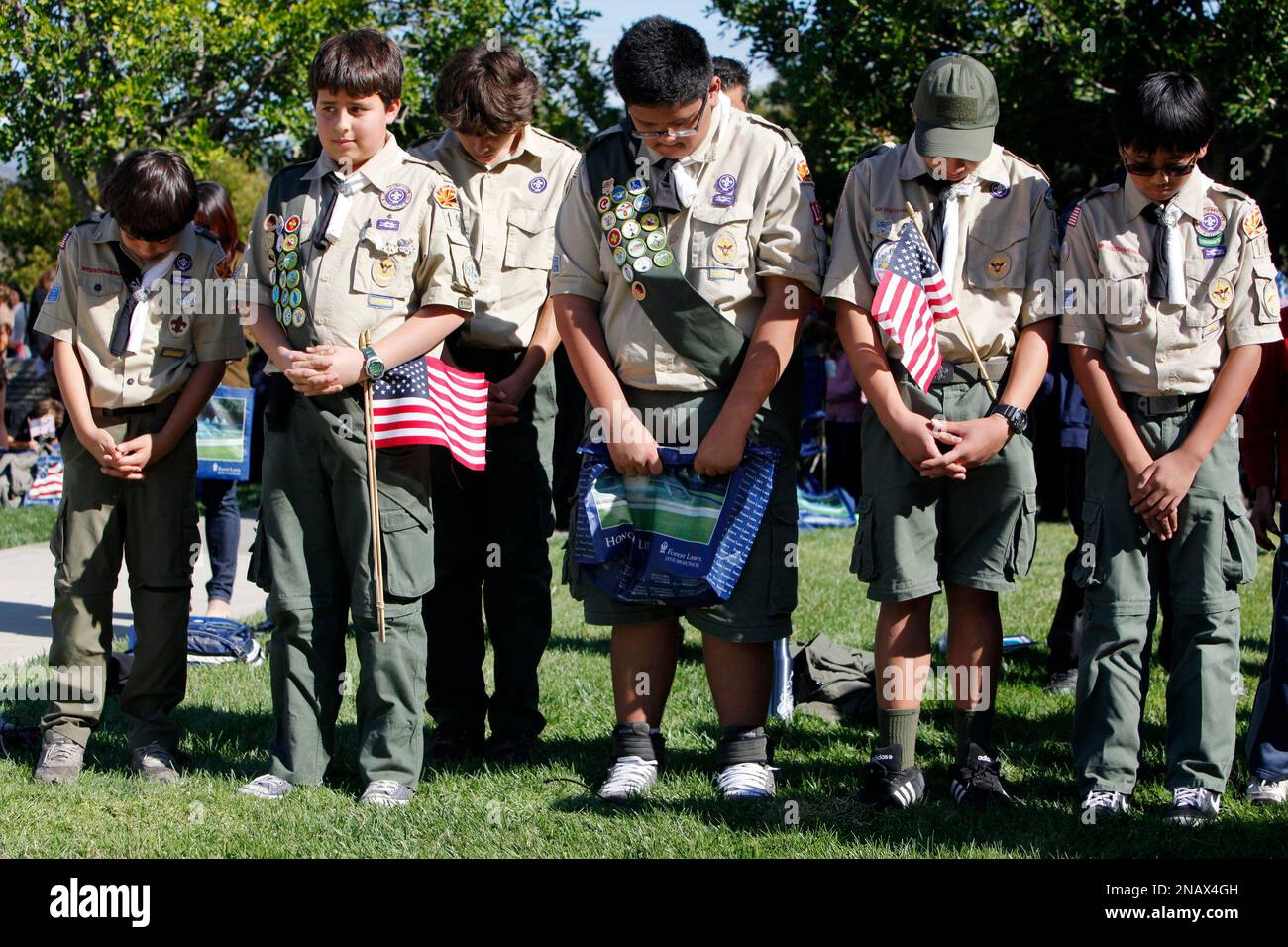 Boy Scouts listen to a military chaplain's benediction during the ...