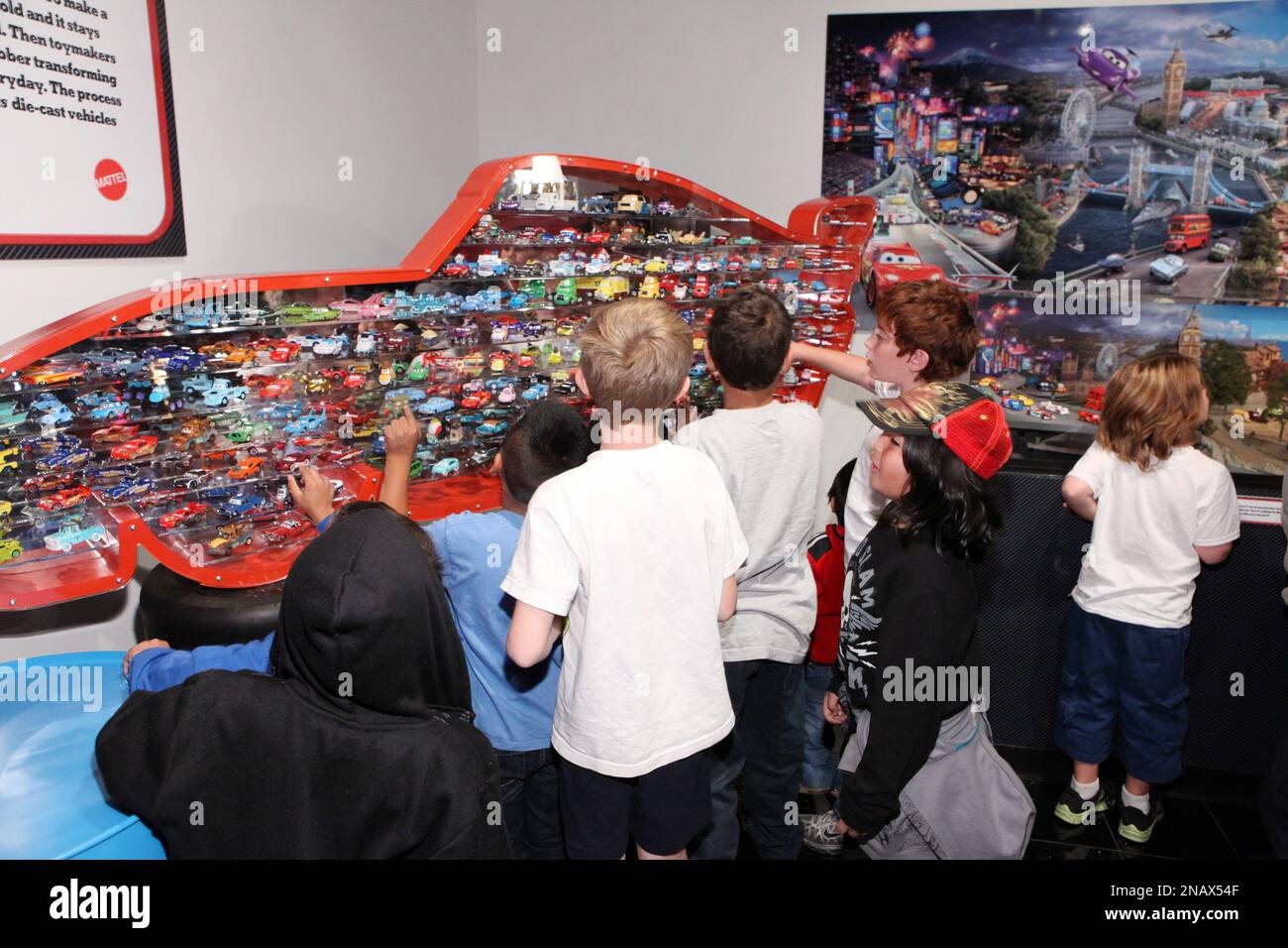 Kids check out the Mattel die-cast cars on display at the launch of the ...