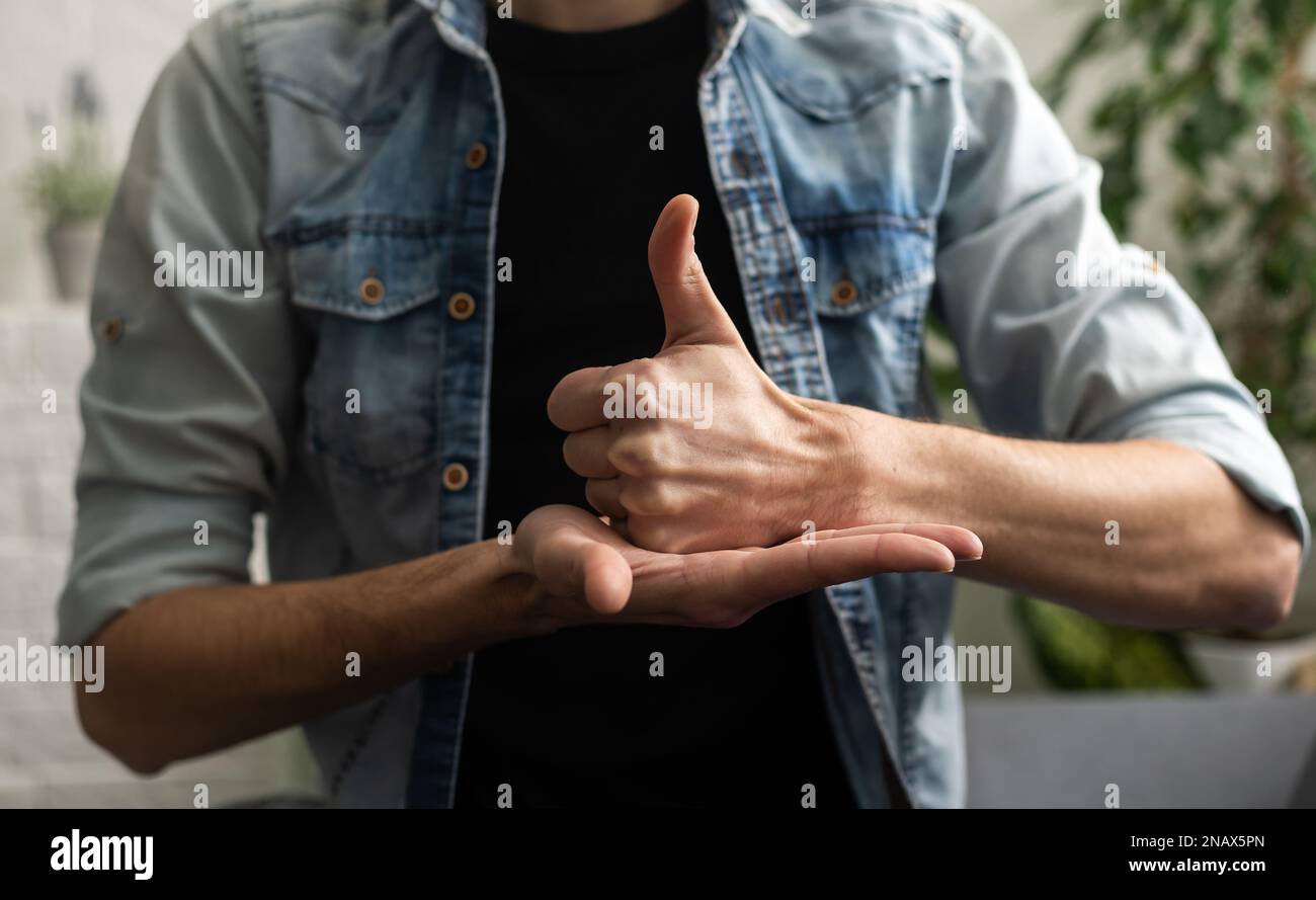 Sign language interpreter man translating a meeting to ASL, American ...