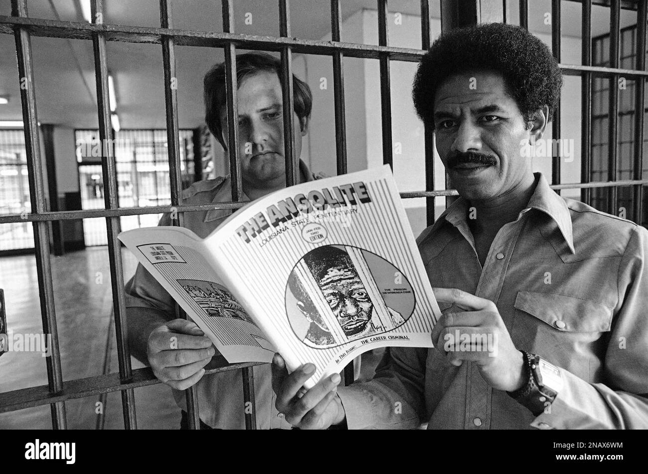 Wilbert Rideau, right, editor of The Angolite, shows a copy of the ...