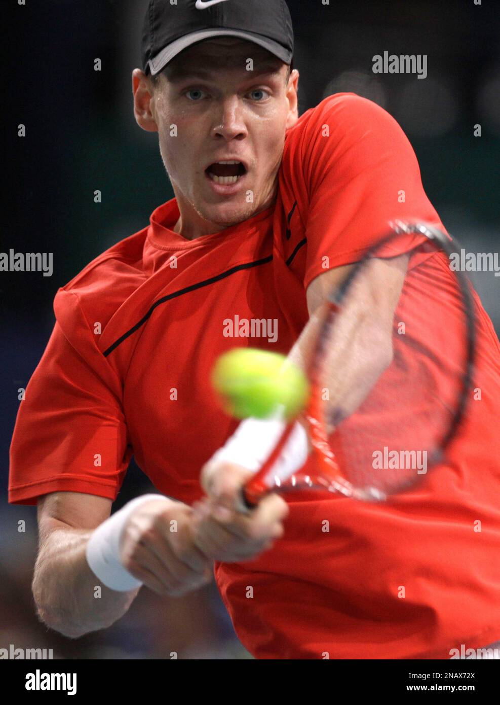 Tomas Berdych of Czech Republic returns the ball to Andy Murray of ...