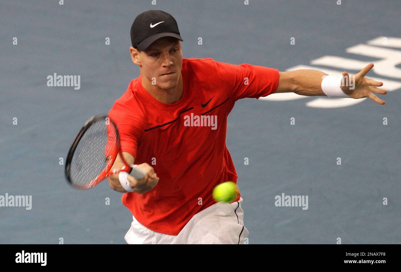 Tomas Berdych of Czech Republic returns the ball to Andy Murray of ...