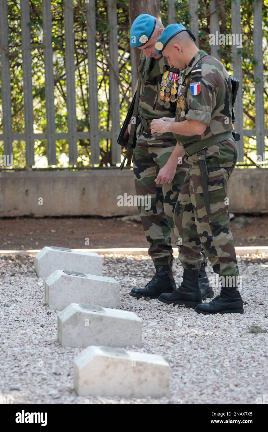 French UN peacekeeper soldiers, take pictures for the grave of a French ...