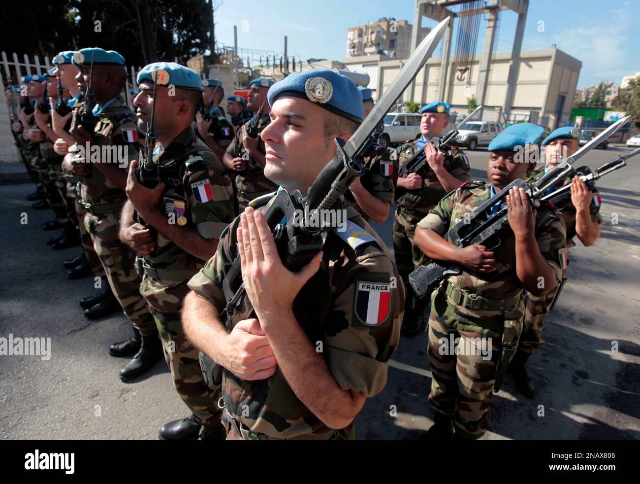 French United Nations peacekeepers stand to attention during a ceremony ...