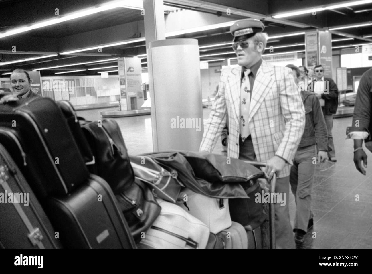 Wearing the cap of a Munich porter, British heavyweight boxer Richard ...