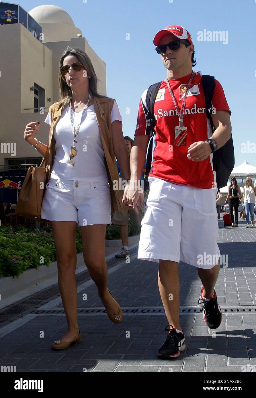 Ferrari driver Felipe Massa of Brazil flanked by his wife Anna Rafaela ...