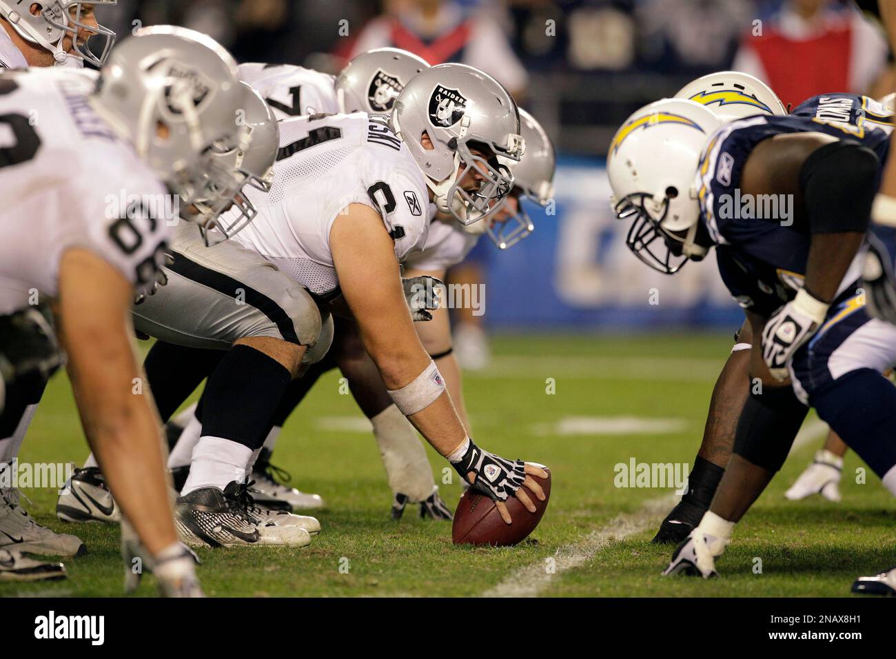 Oakland Raiders center Samson Satele, center, holds the ball on the ...