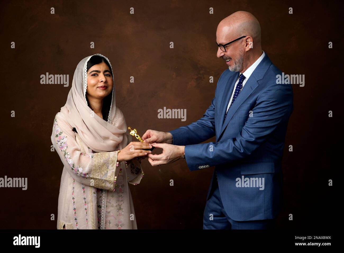 Malala Yousafzai, left, and Joshua Seftel pose with a miniature Oscar ...