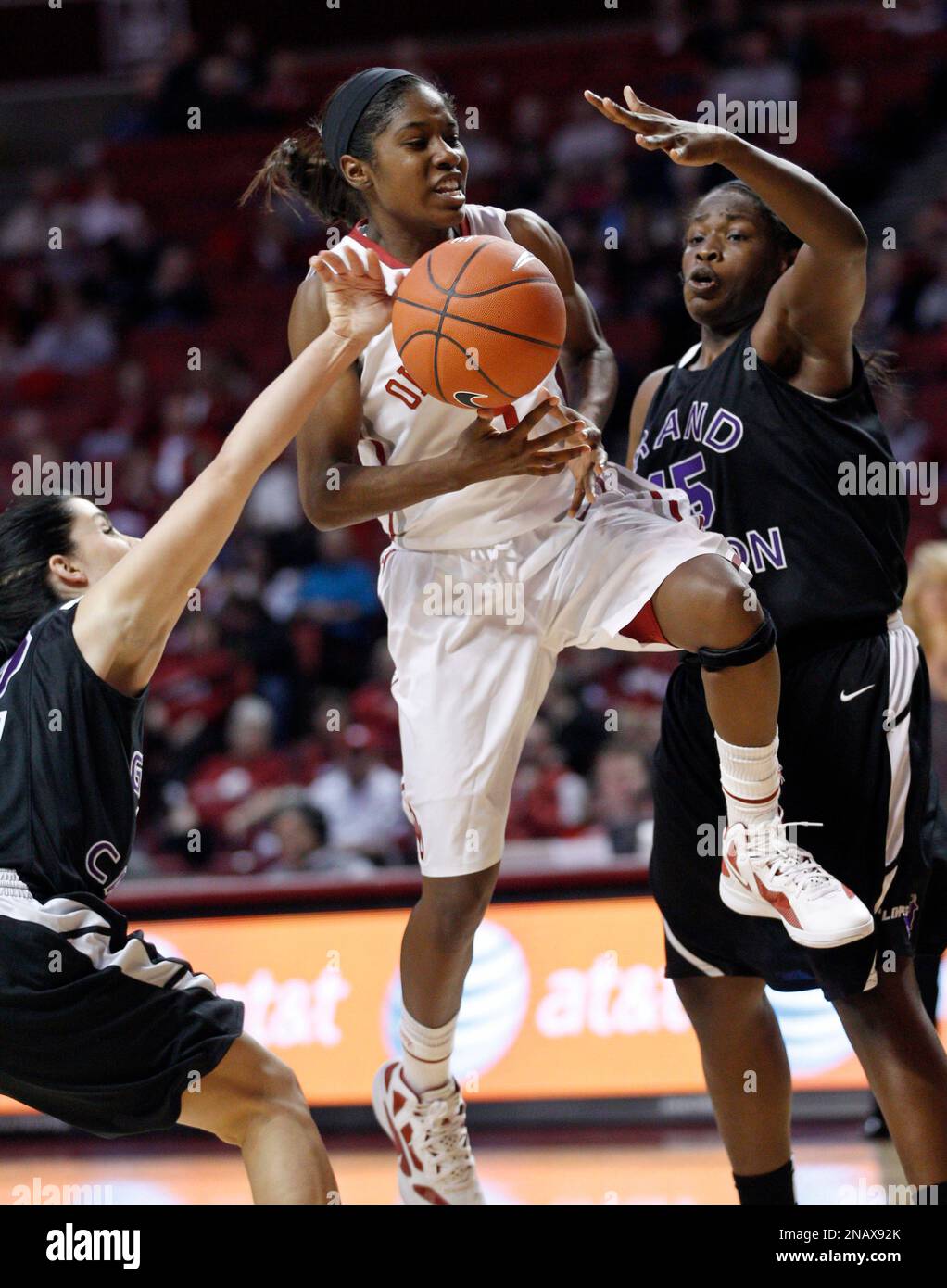 Oklahoma's Aaryn Ellenberg, center, has the ball knocked away as she ...
