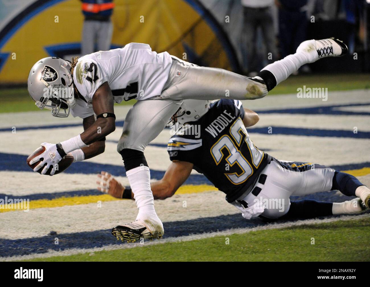 Oakland Raiders wide receiver Denarius Moore (17) scores a second-quarter touchdown past San ...