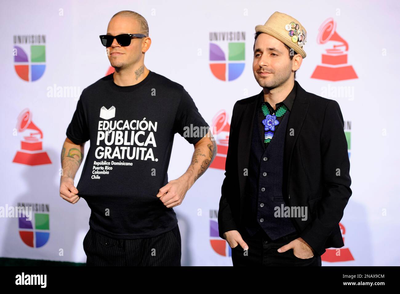 Rene Perez Joglar, left, and Eduardo Cabra Martinez, of Calle 13, arrive at the 12th Annual ...