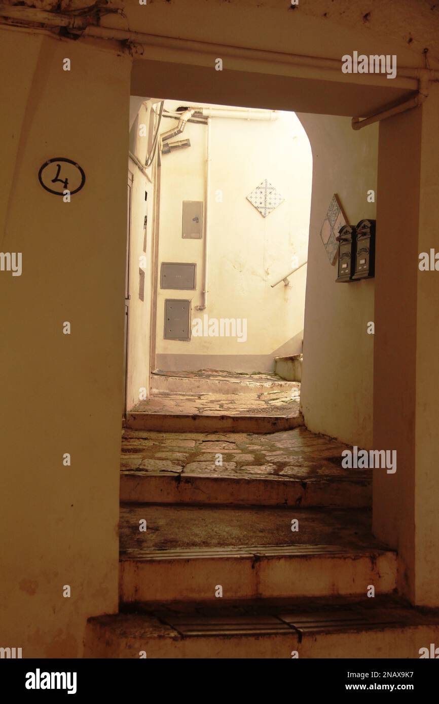 Gaeta, Italy. Narrow passageway with steps leading to a residential ...