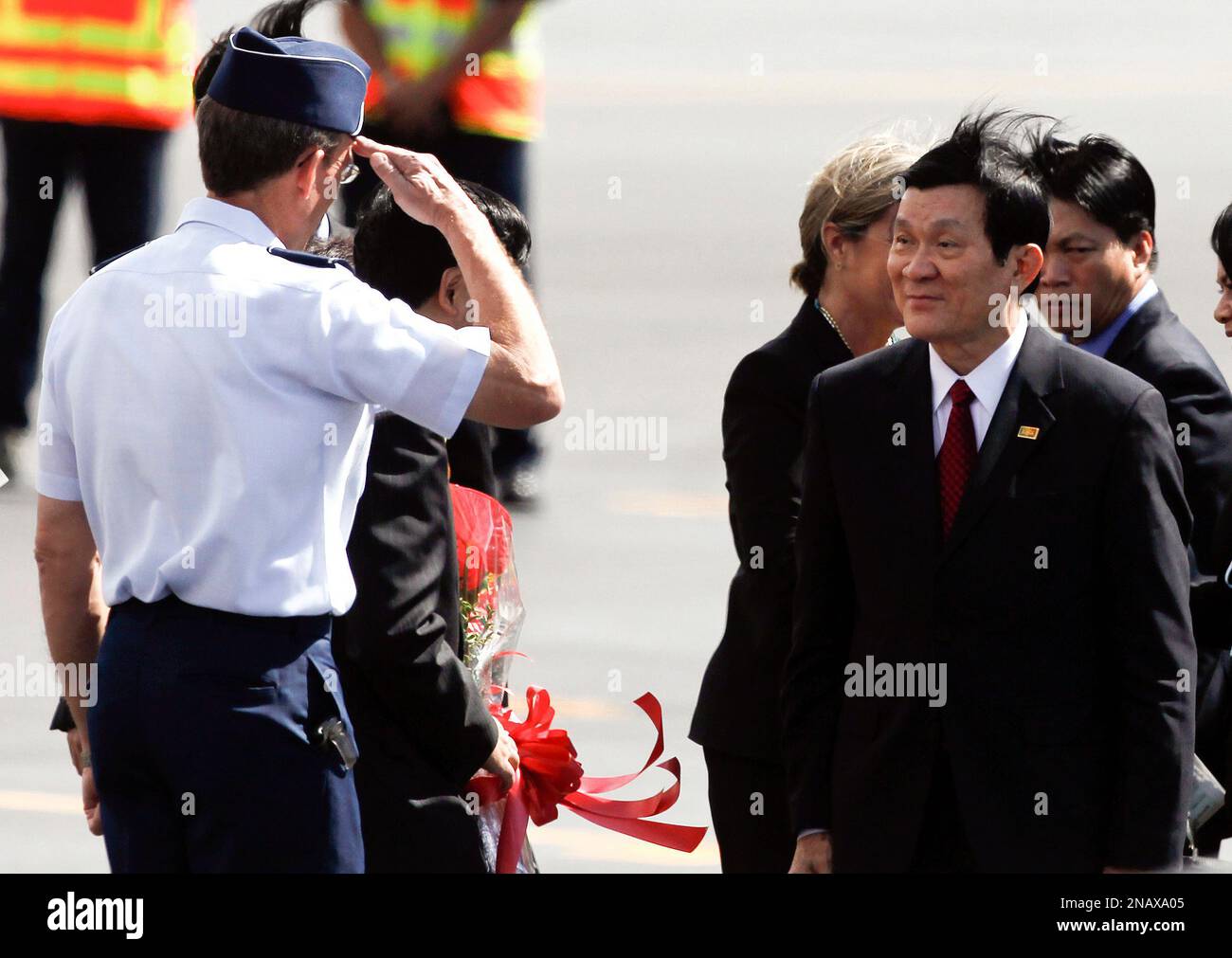 Maj. Gen. Jon R. Shasteen, left, greets Vietnamese President Truong Tan ...