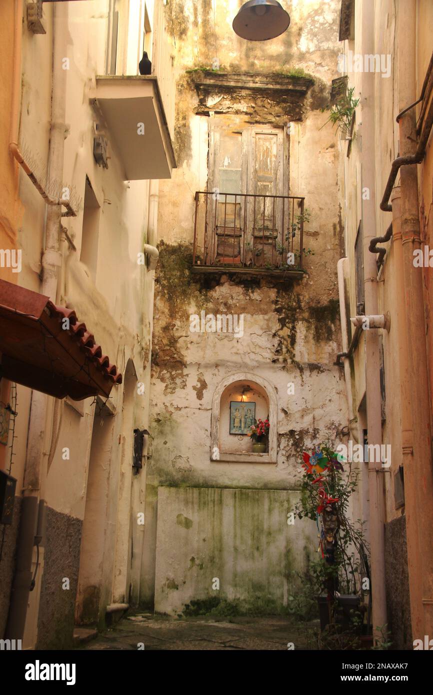 Gaeta, Italy. Narrow unkempt alleyway between residential buildings in ...