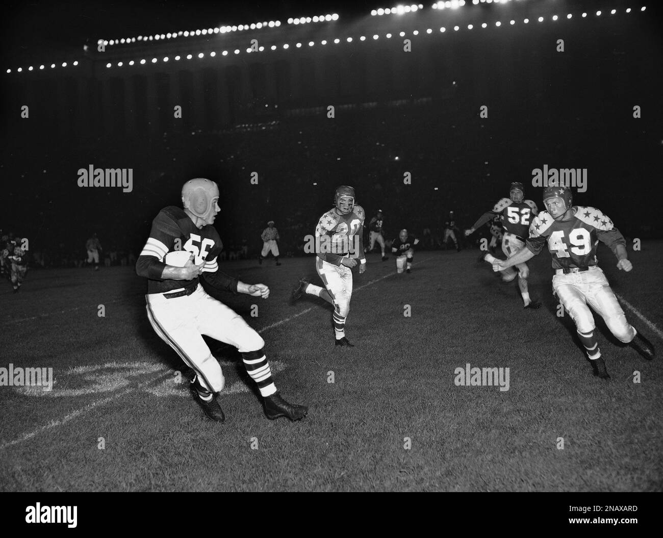 Cleveland Browns player Dante Lavelli (56) gains 20 yards after taking ...