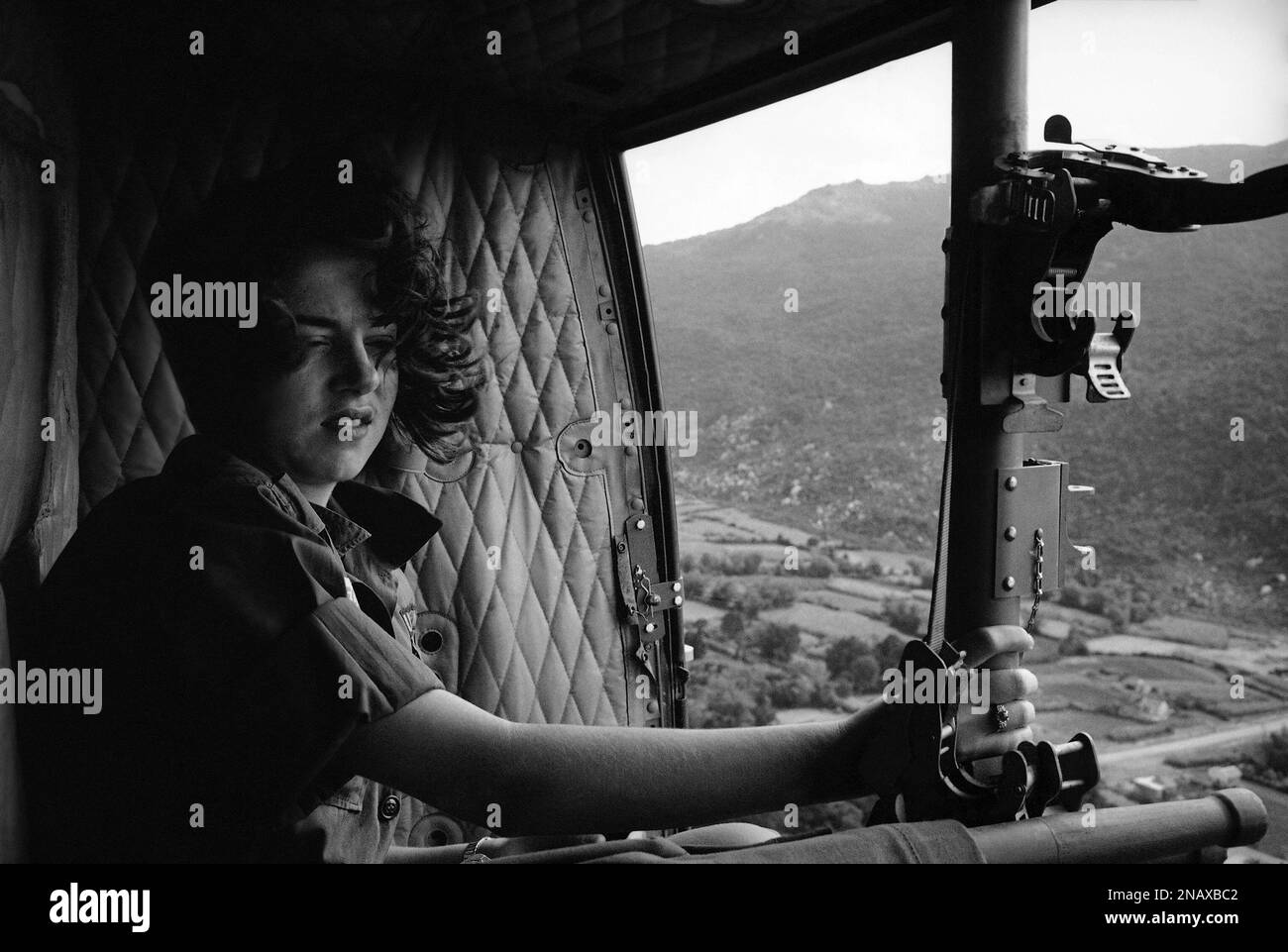 Army nurse 1st Lt. Sharon Forman looks out from medical helicopter with ...