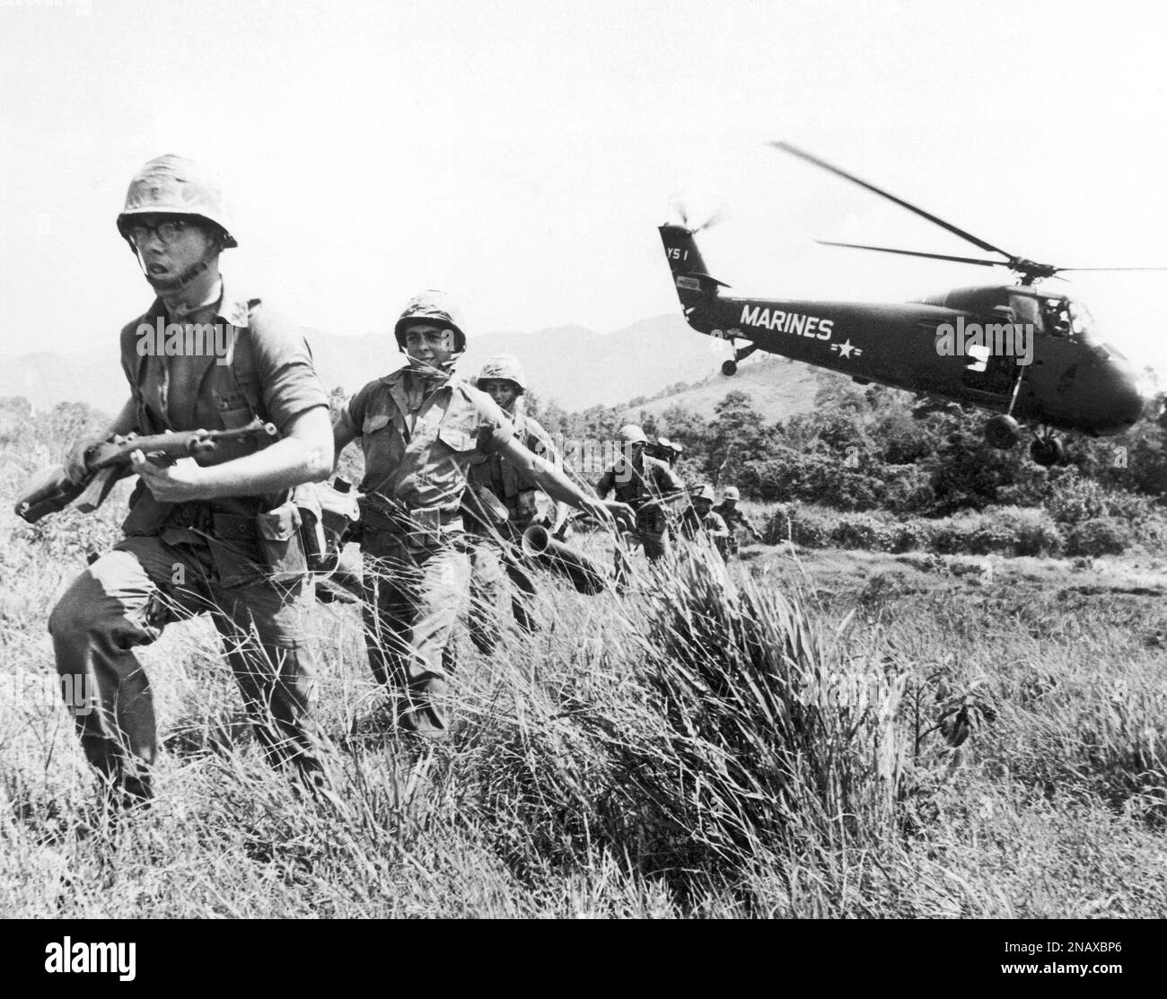 U.S. Marine infantry stream into a suspected Viet Cong village near Da ...