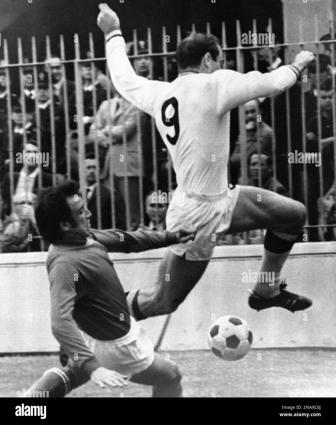 Centre-forward Raoul Lambert of Belgium jumps over Pierluigi Cera of ...