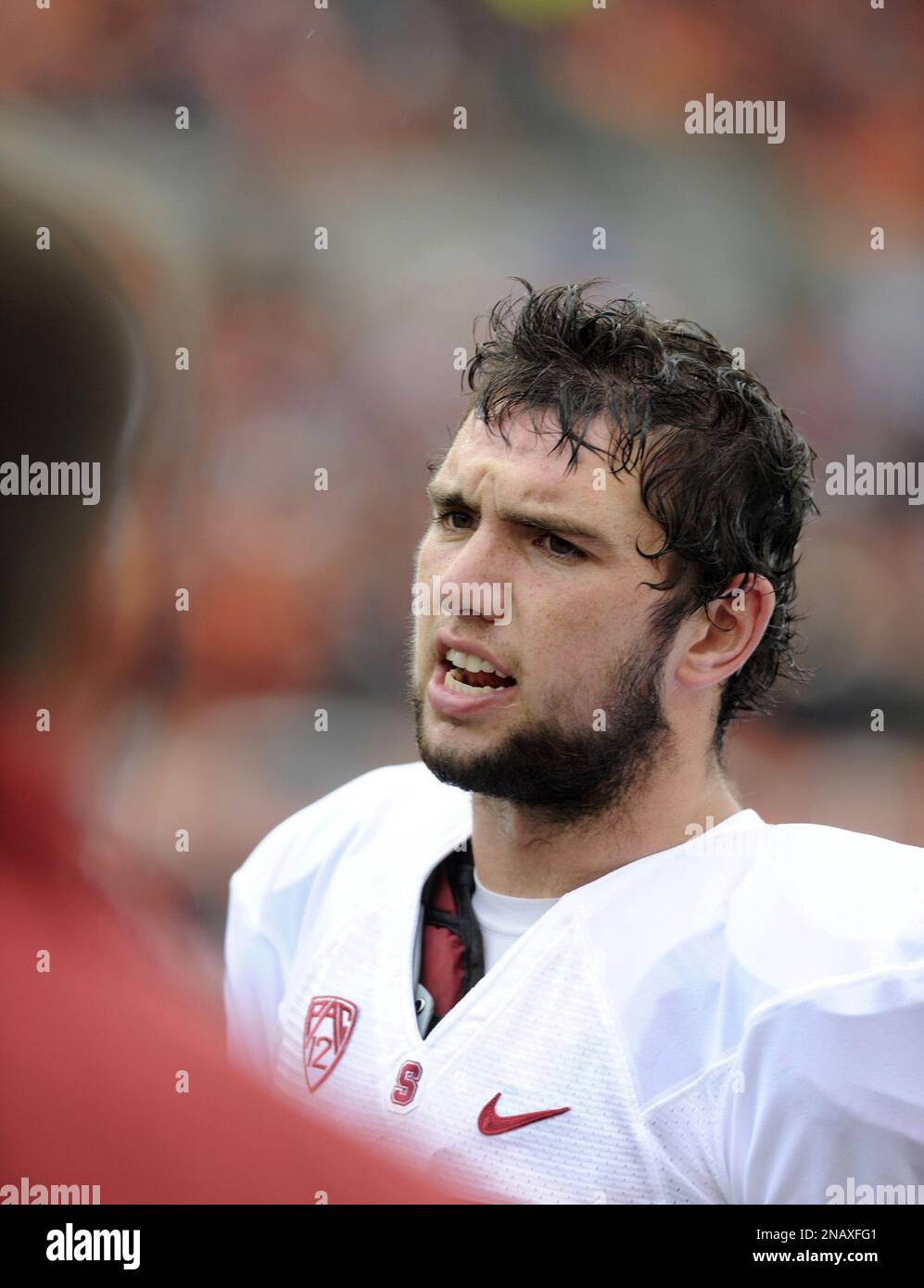Stanford quarterback Andrew Luck (12) talks to teammates during the ...