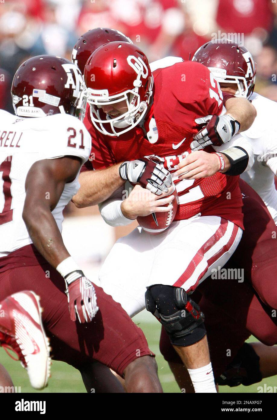 Oklahoma Sooners quarterback Landry Jones (12) is sacked in the first ...