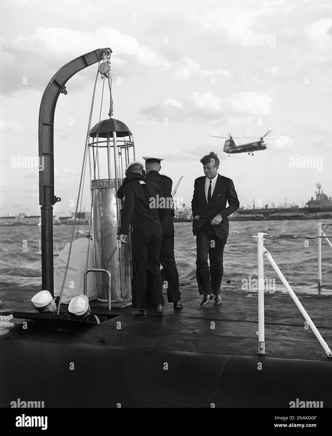 President John. F. Kennedy looks back at the elevator which brought him ...