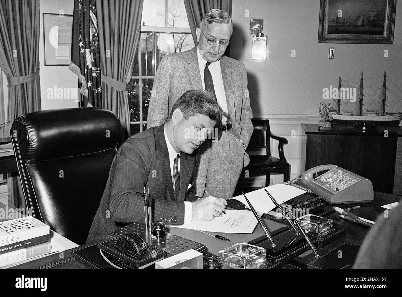 With Rep. Clark W. Thompson of Texas watching, President John F ...