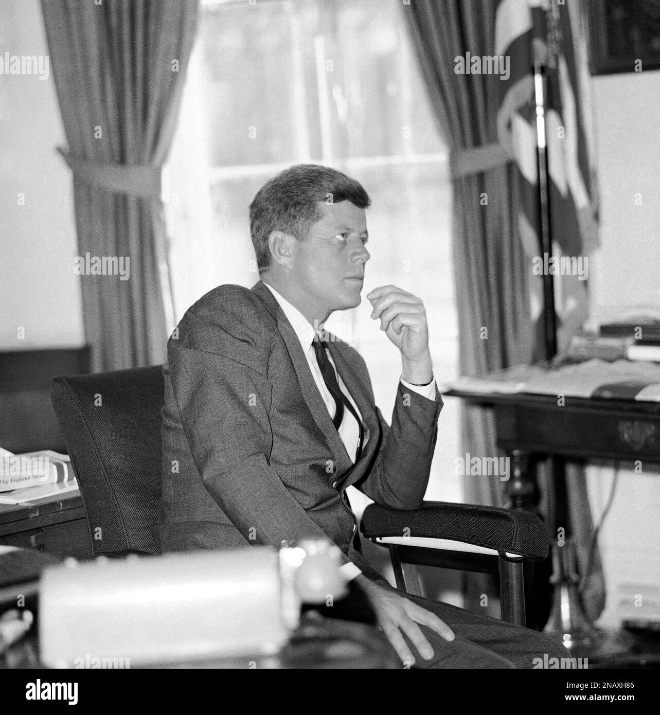 President John F. Kennedy reflects for a moment in his White House ...