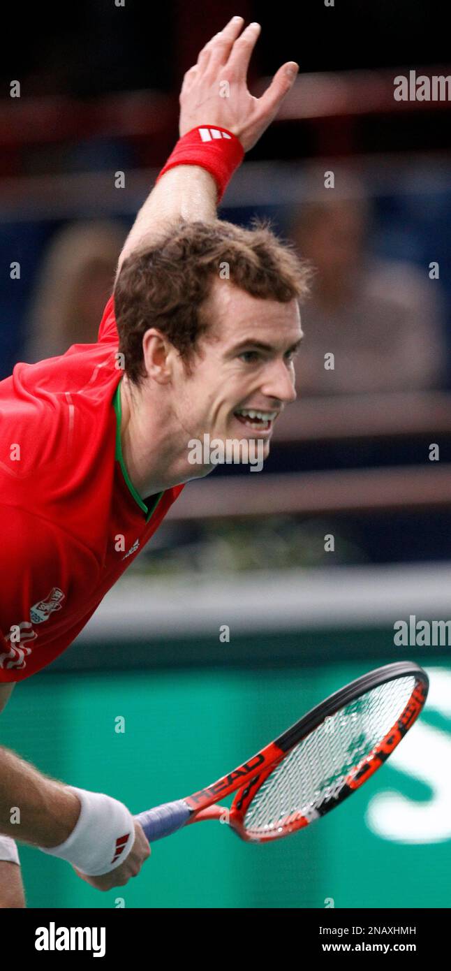 Andy Murray of Great Britain returns the ball to France's Jeremy Chardy ...