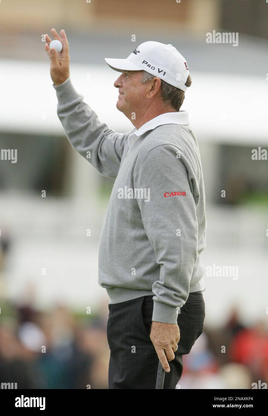 Jay Haas waves on the 18th green during the final round of the Charles ...