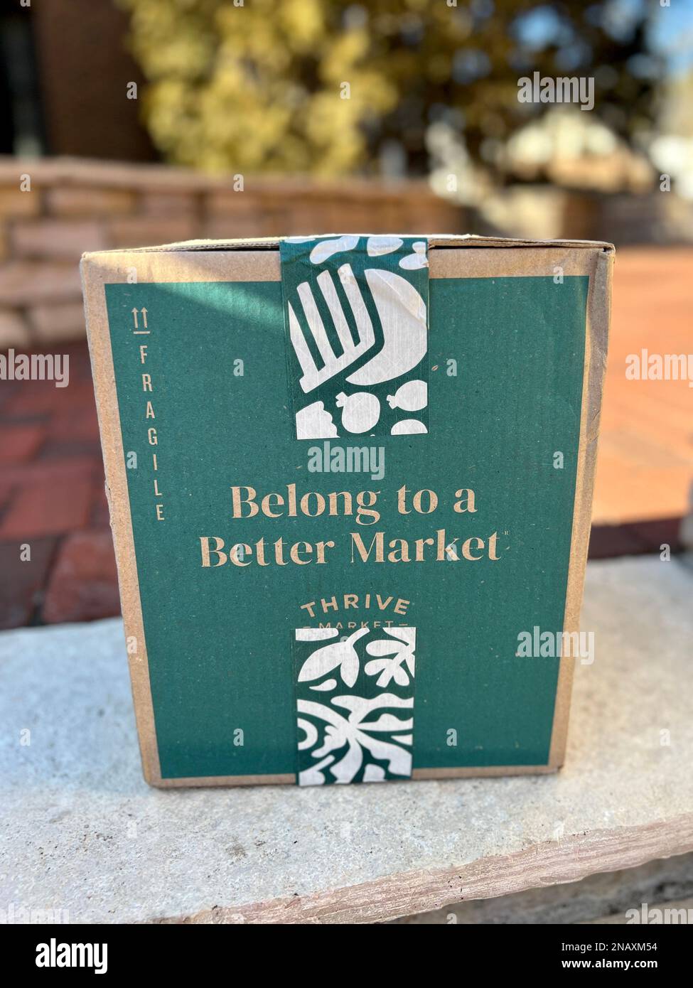 Box on a doorstep from Thrive Market, an American e-commerce membership ...