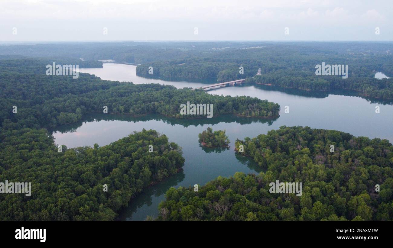 An aerial view of a river in a forest landscape in Loch Raven with a ...