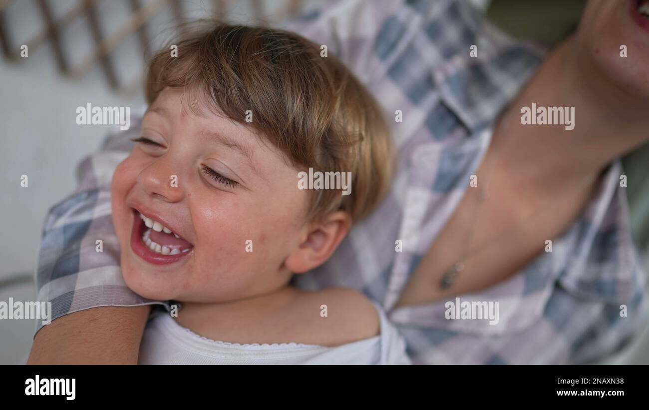 Happy Child and mother laughing and smiling together. Parenting ...