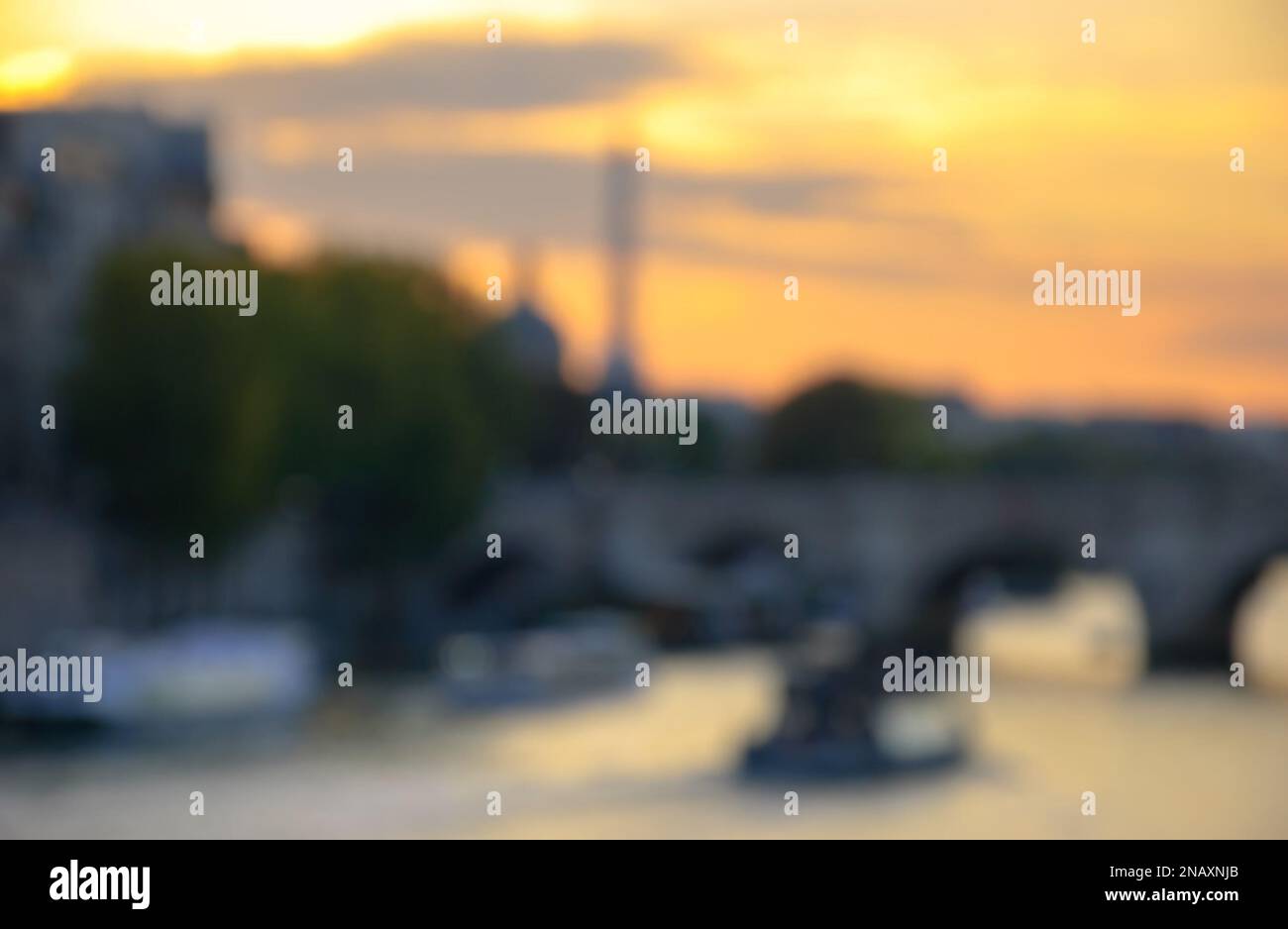 Blurry view of bridge over the Seine river and Eiffel tower at ...