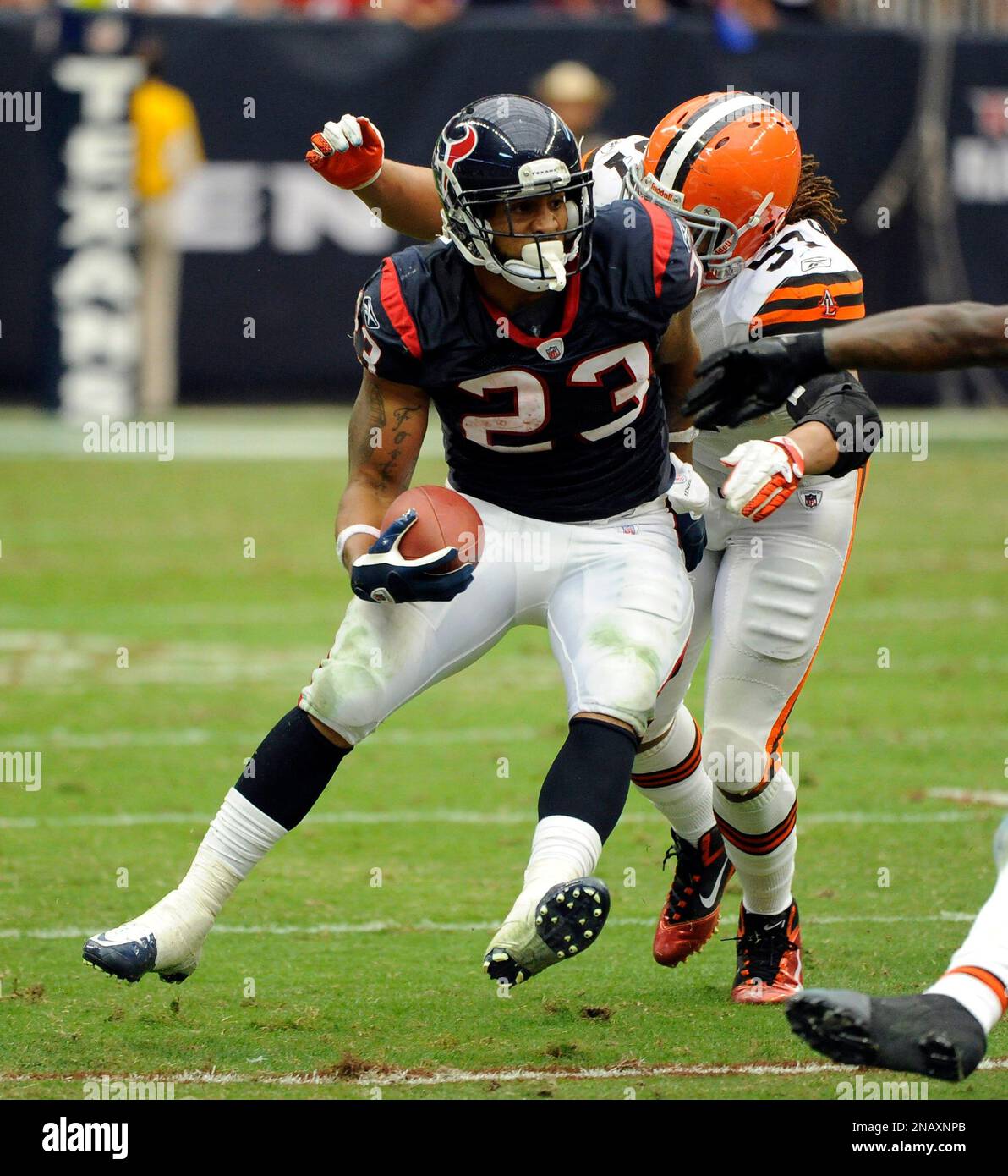 Houston Texans running back Arian Foster (23) is tackled by Cleveland ...