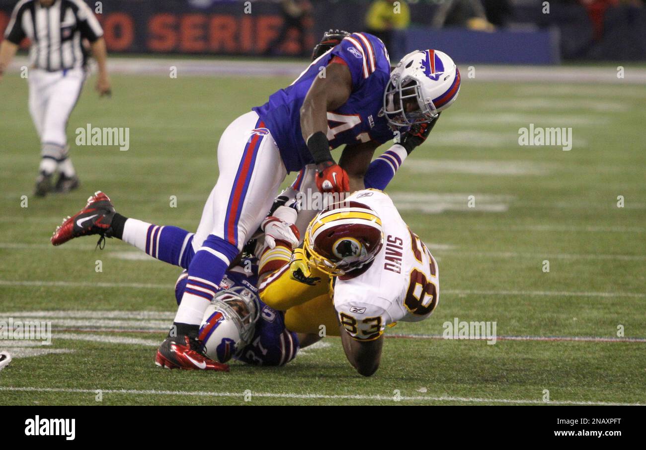 Buffalo Bills' George Wilson (37) and Bryan Scott (43) tackle ...