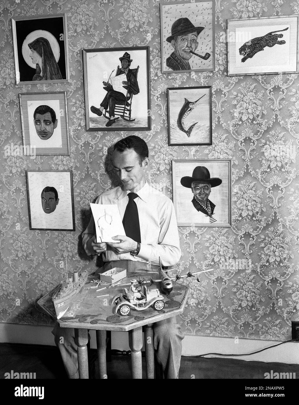 Kelvin Anderson of Los Angeles, a railroad clerk by profession, makes ...