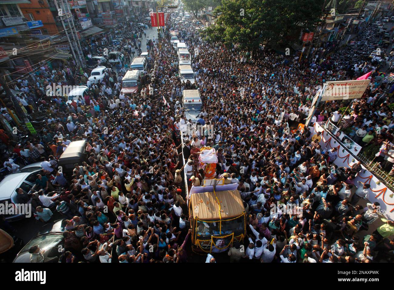 People crowd in to pay homage as the body of legendary Indian singer ...