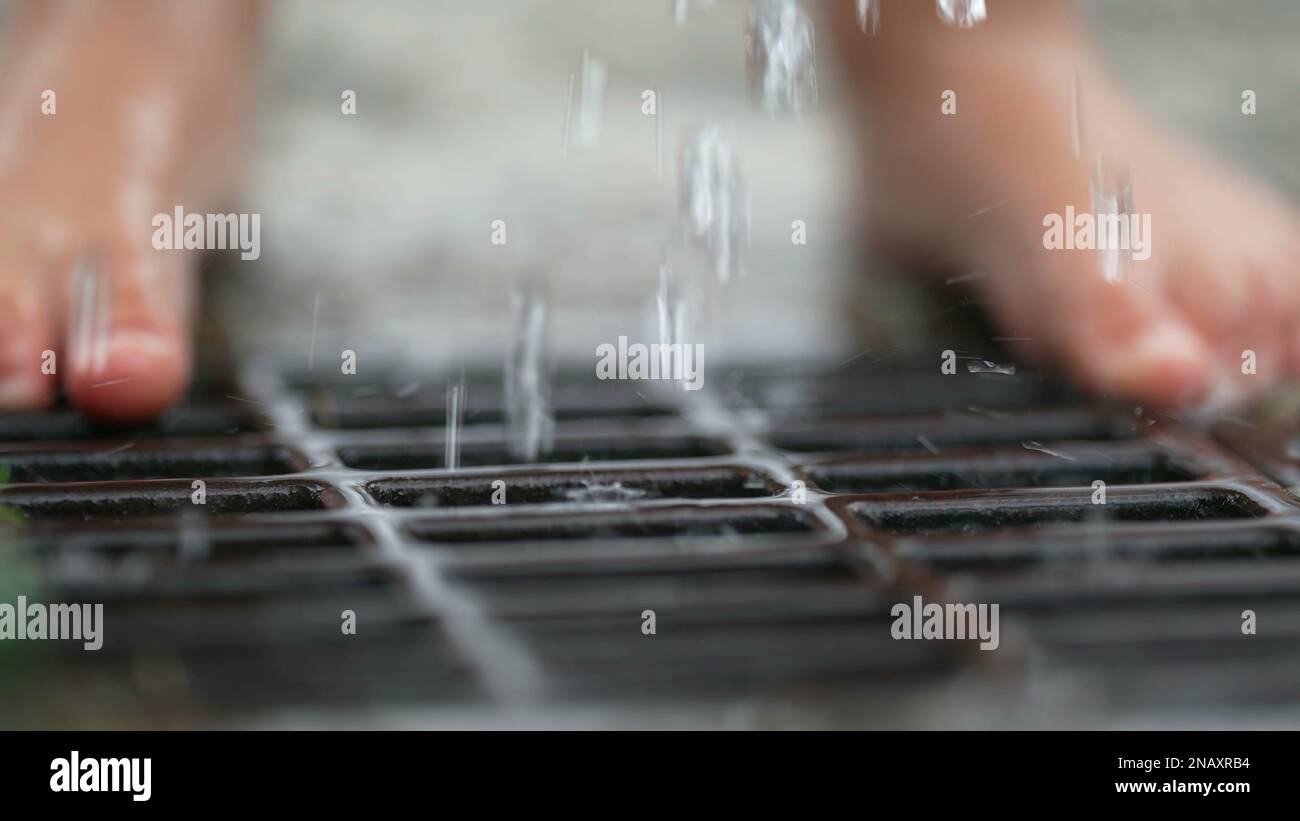 Water pouring into sewage system. Public water faucet droplets falling ...