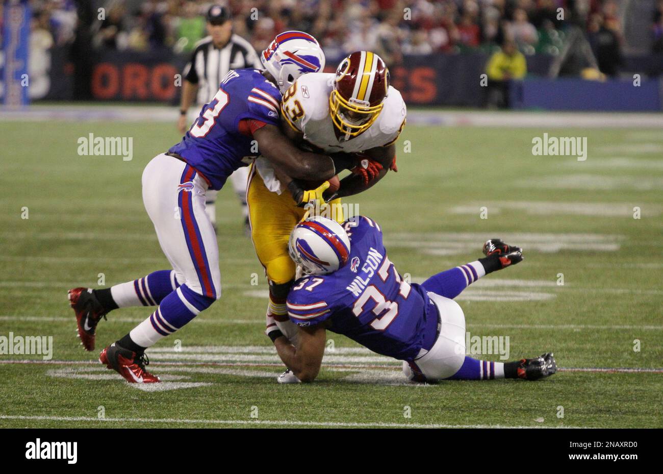 Buffalo Bills' George Wilson (37), Bryan Scott (43) tackle Washington ...