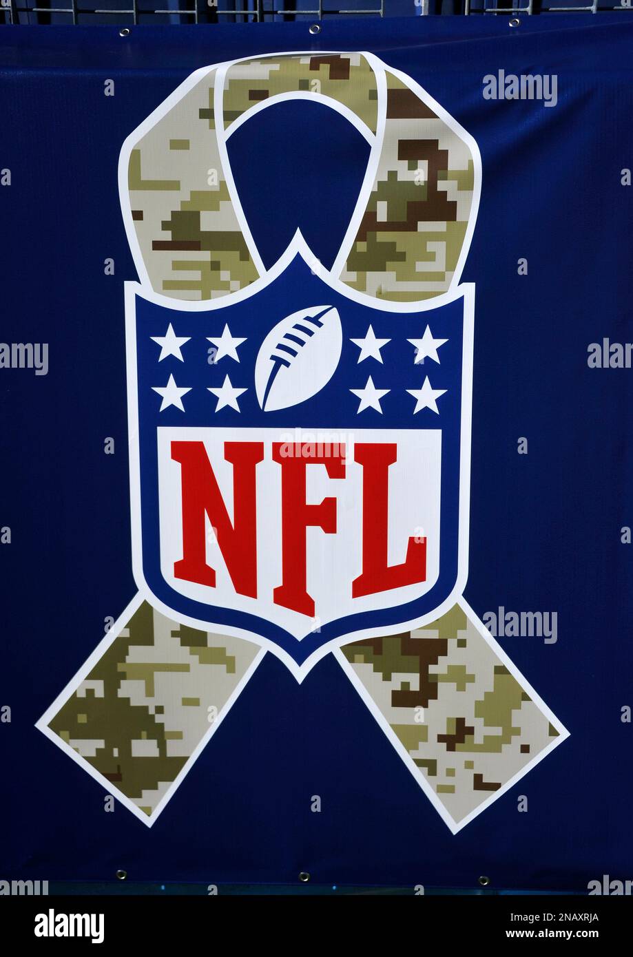 The NFL logo with a camouflage ribbon is displayed as part of a ...