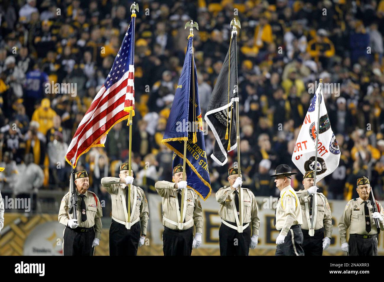 Members of the Titusville, Pa, VFW carry the flags in the color guard ...