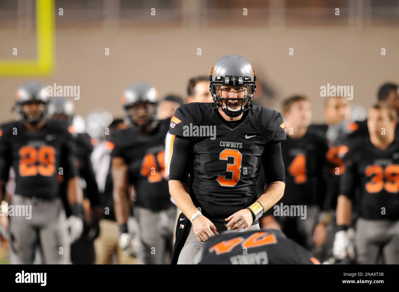 Oklahoma State University quarterback Brandon Weeden warms up before ...