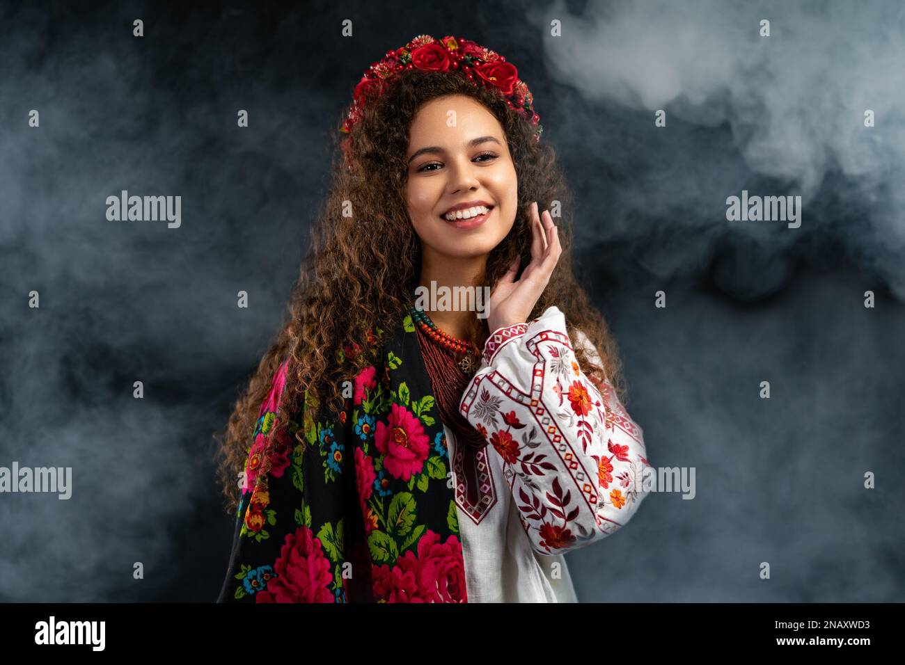 Beautiful woman in ethnic ukrainian costume on black. Ukraine, style ...