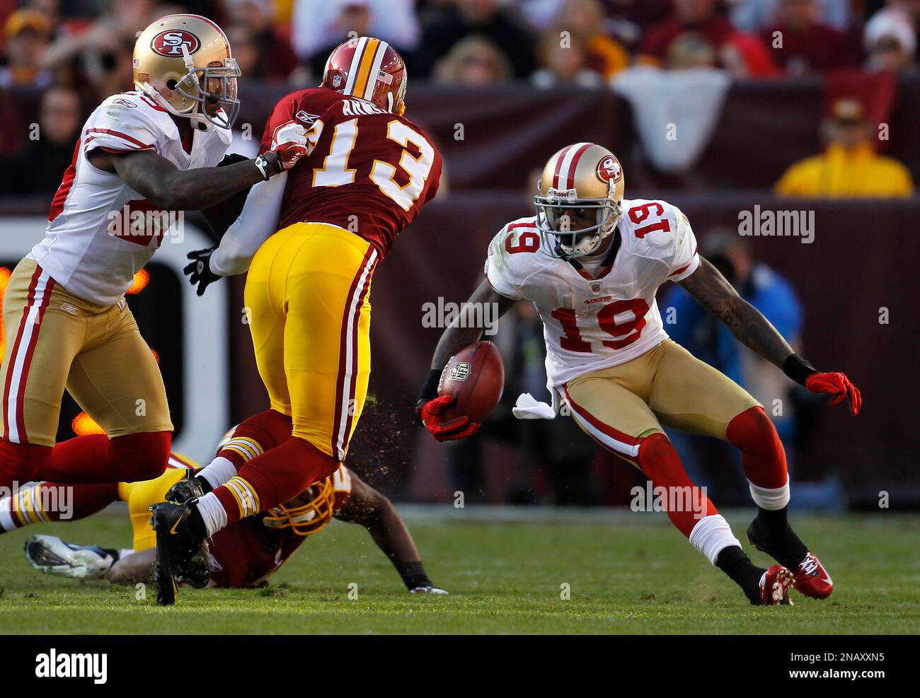 San Francisco 49ers wide receiver Ted Ginn (19) looks to rush past ...