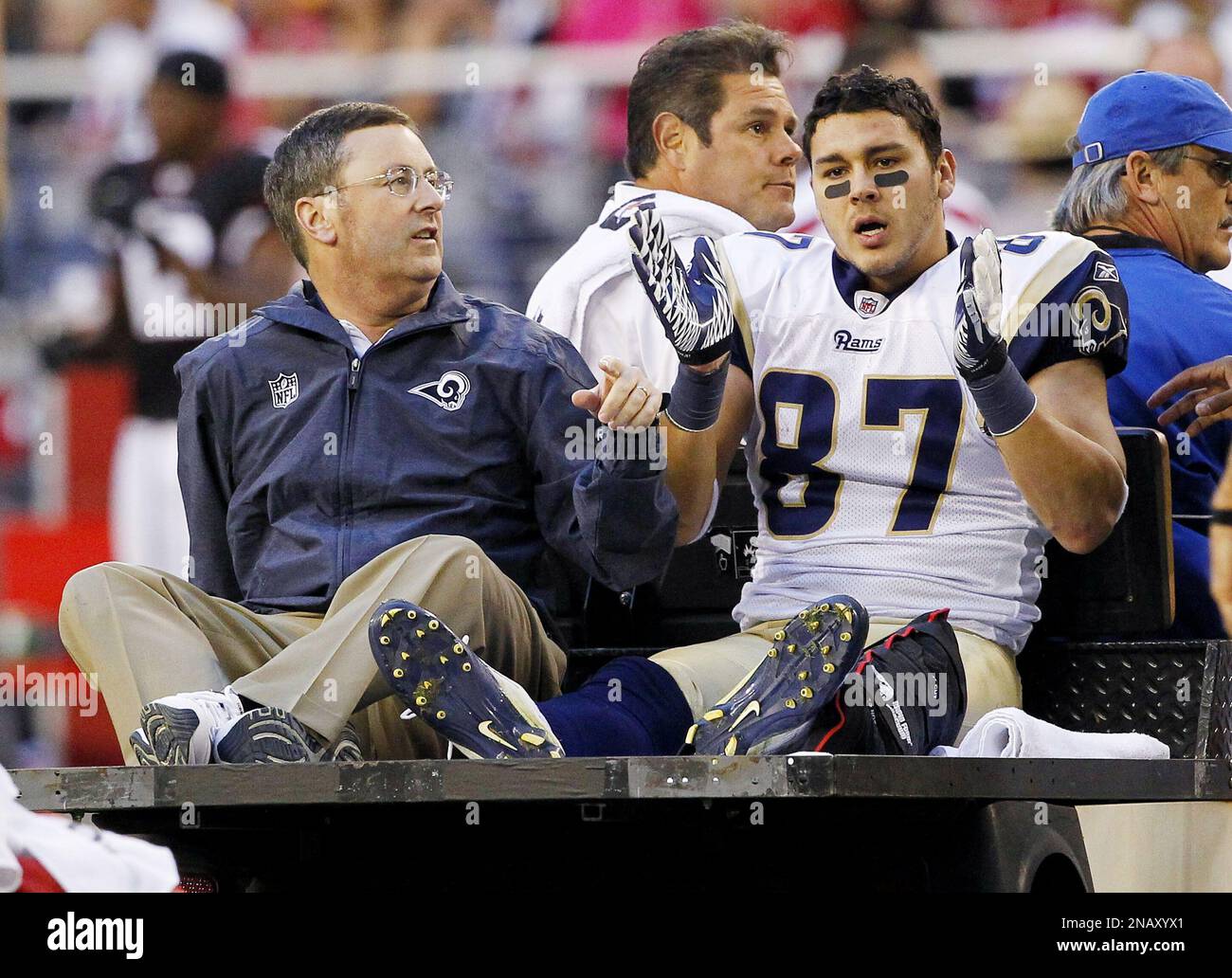 St. Louis Rams' Greg Salas (87) claps for his teammates as he is carted ...