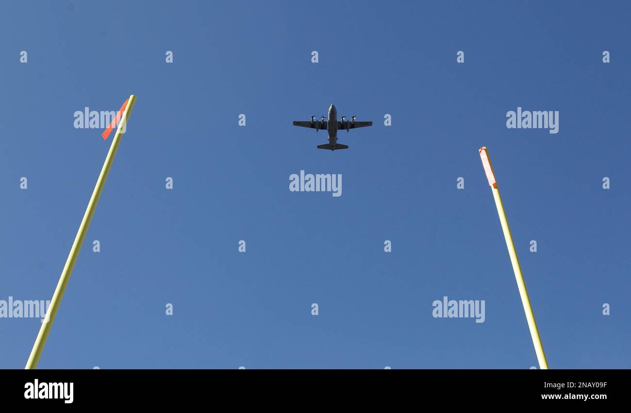 A military aircraft flies over Ralph Wilson Stadium before an NFL ...
